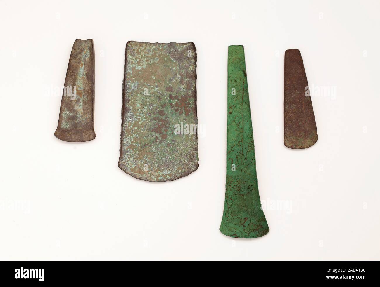 Four simple flat axes, or celts, made of copper. Most originate from ...