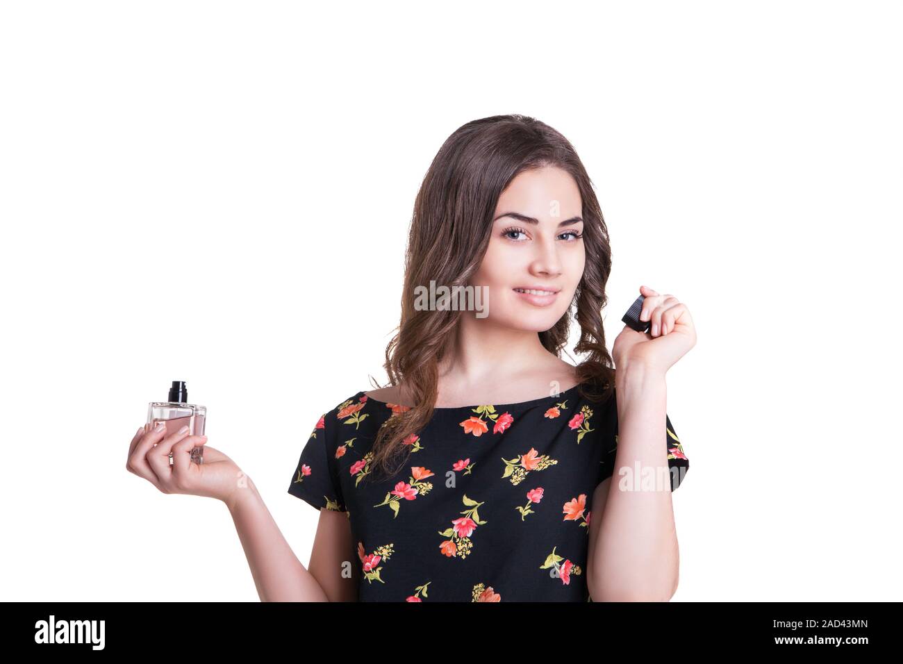 young woman enjoying a smell of the perfume Stock Photo - Alamy