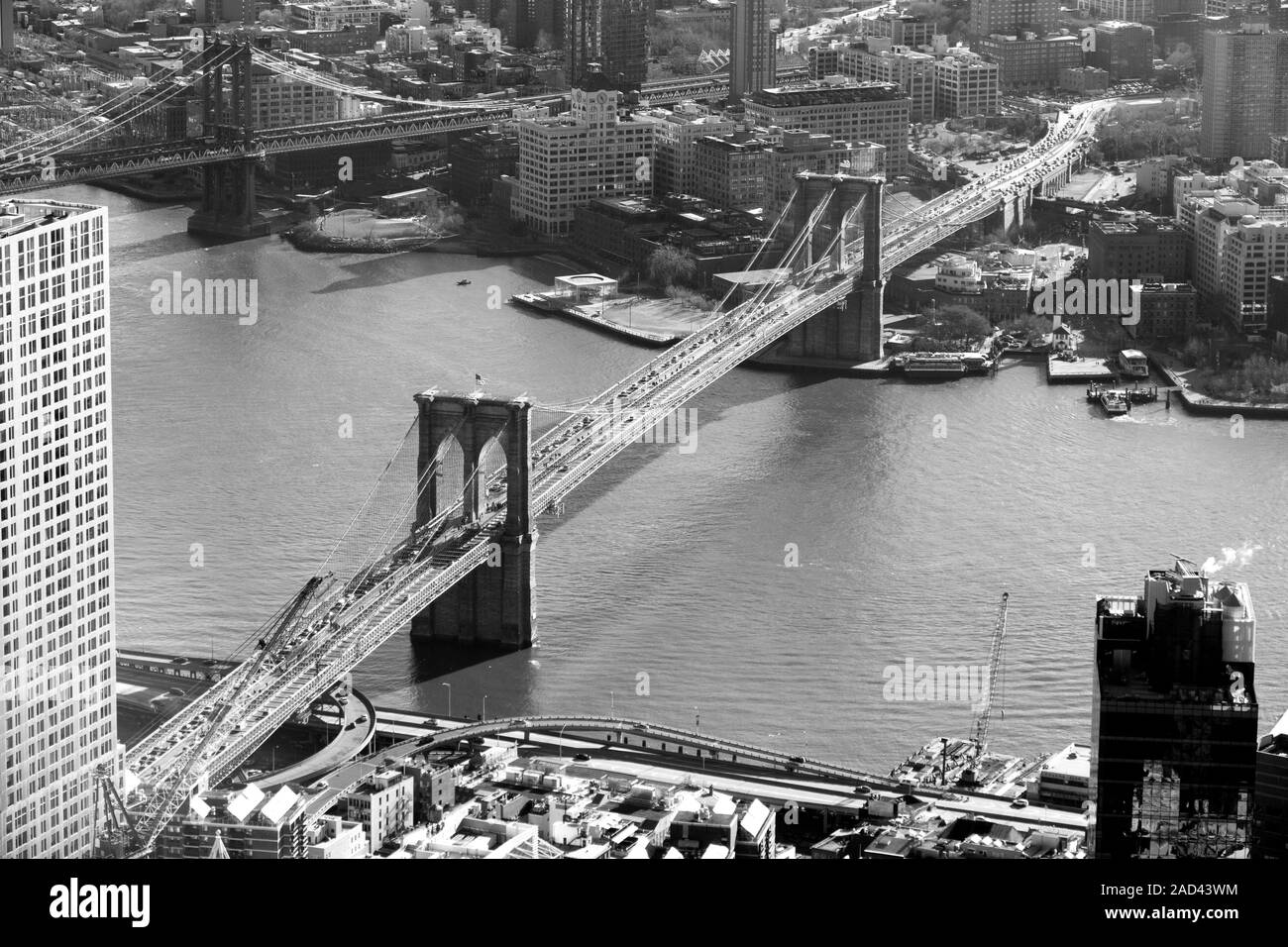 Lower Manhattan the iconic Brooklyn Bridge spanning the East River, New ... Lower Manhattan the iconic Brooklyn Bridge spanning the East River, New ...