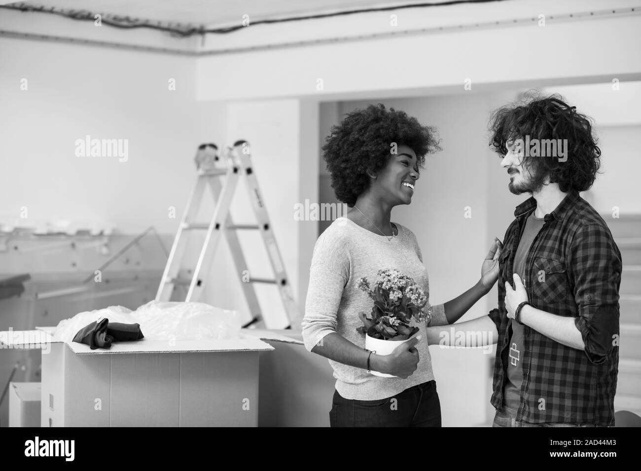 Young smiling multiethnic couple Black and White Stock Photos & Images ...