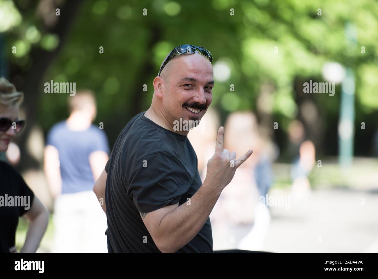 man showing a rock hand gesture Stock Photo - Alamy