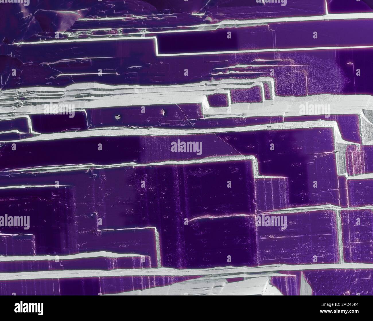 Coloured scanning electron micrograph (SEM) of fractured amethyst ...