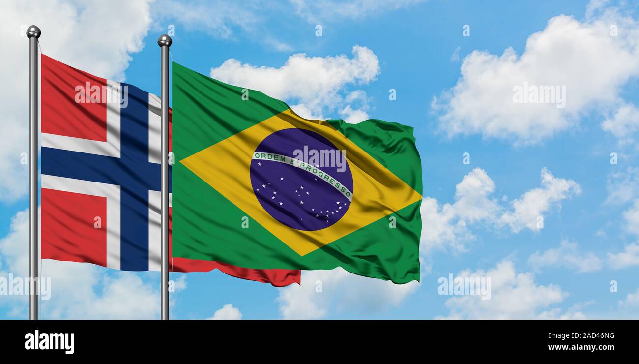 Norway and Brazil flag waving in the wind against white cloudy blue sky ...