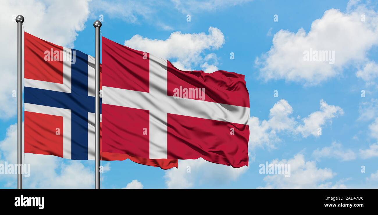Norway and Denmark flag waving in the wind against white cloudy blue ...