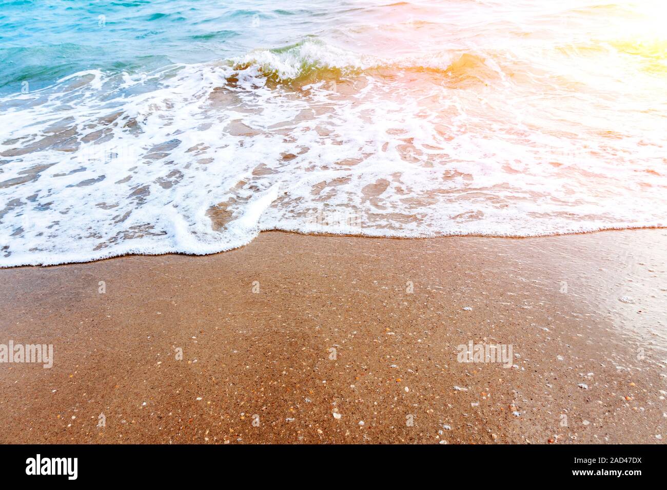 Sea wave runs onto the sandy shore. Tidal water surf Stock Photo - Alamy