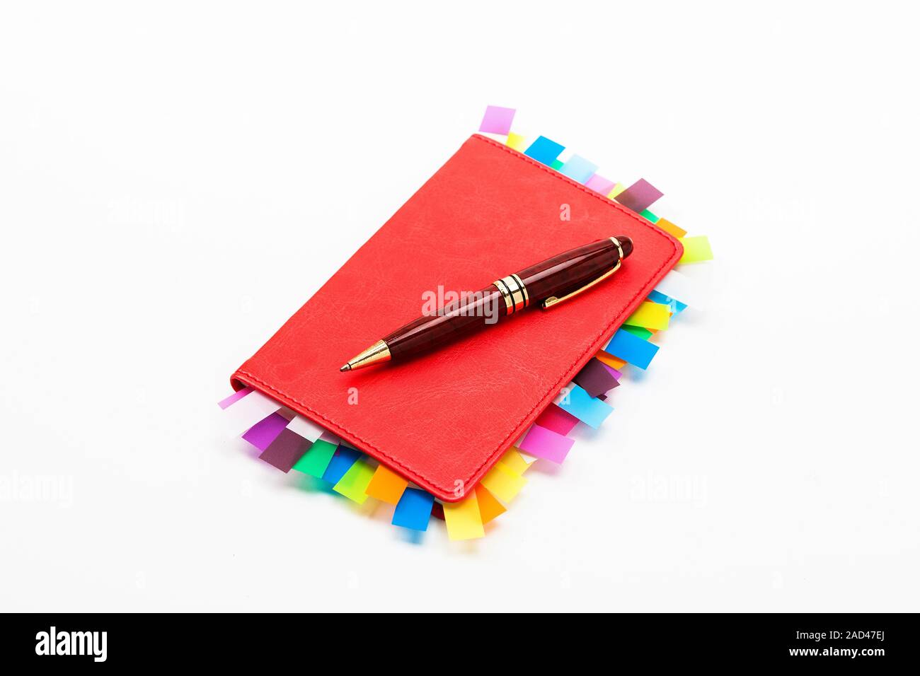 Red copybook with red pen Stock Photo - Alamy