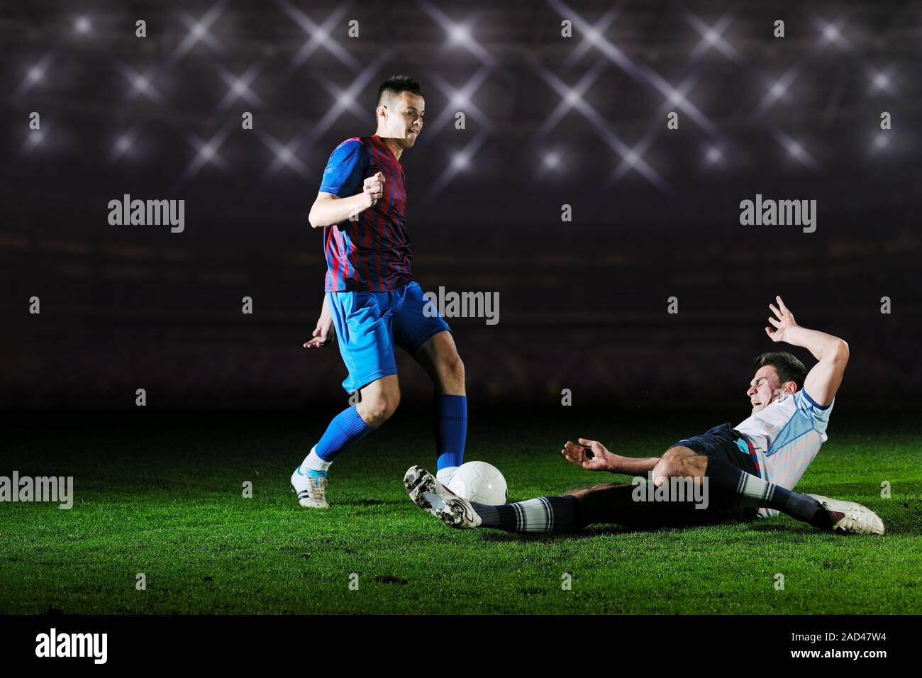 football players in competition for the ball Stock Photo - Alamy