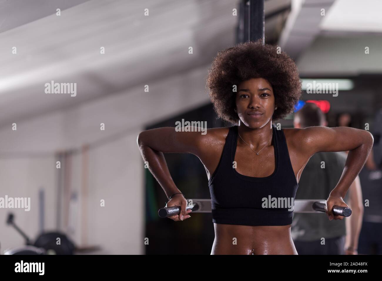 black woman doing parallel bars Exercise Stock Photo - Alamy