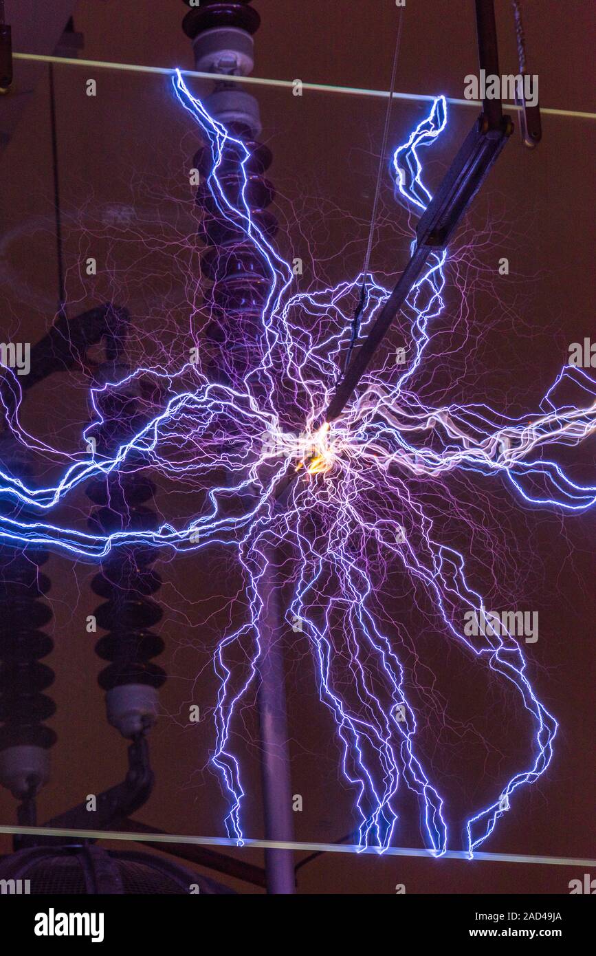 High voltage discharge between electrodes separated by a glass sheet. A ...