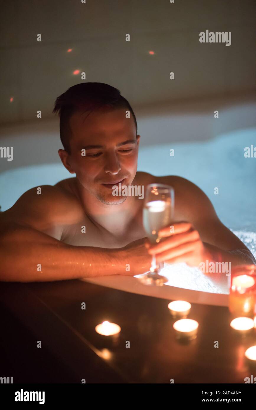 man relaxing in the jacuzzi Stock Photo - Alamy