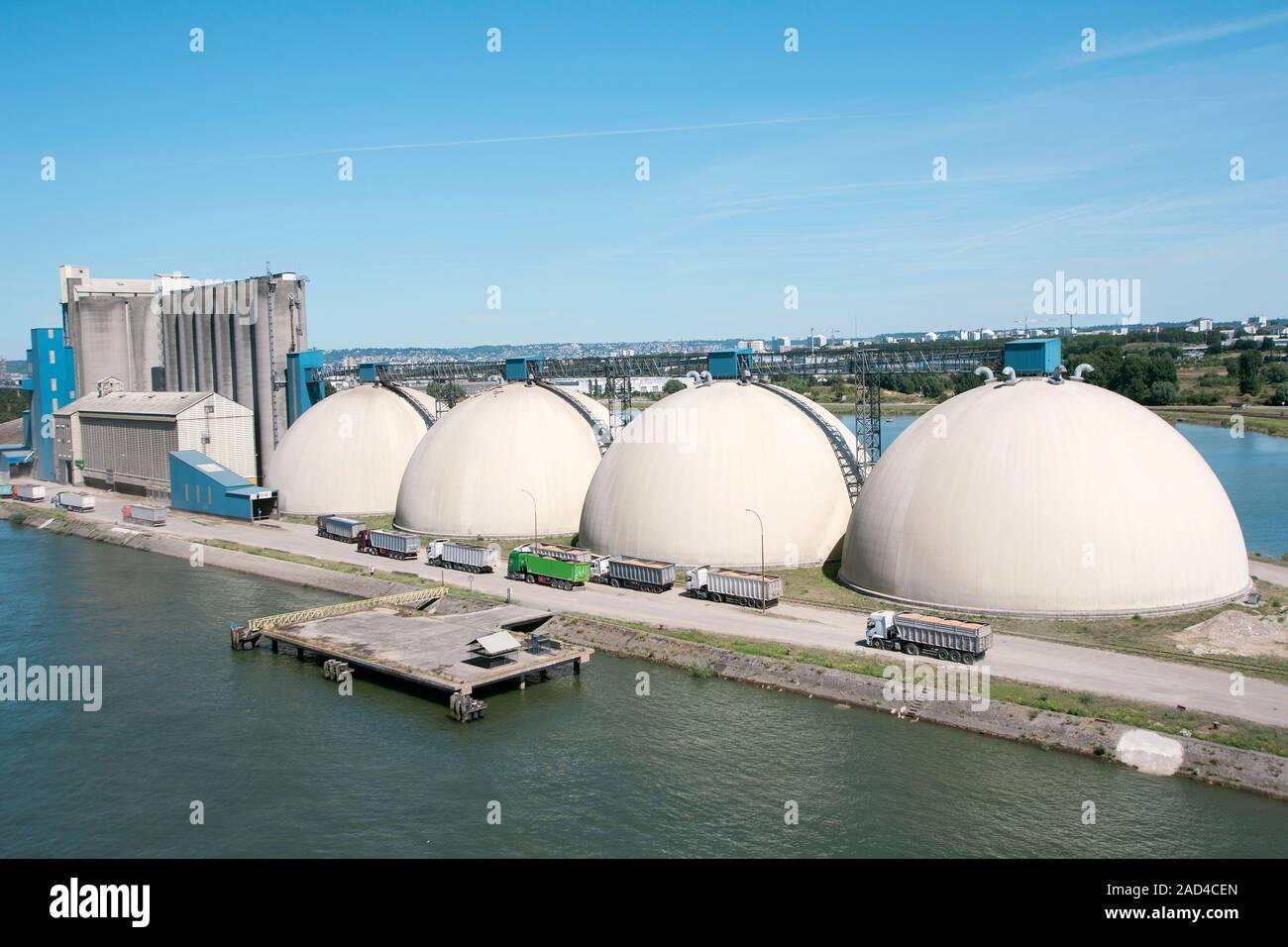 Grain silos. Lorries bringing wheat for storage in large grain silos ...