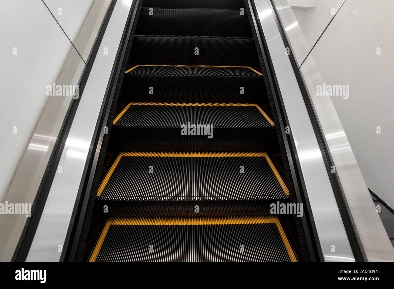 Modern escalator electronic system moving. Escalator is moving up.The ...