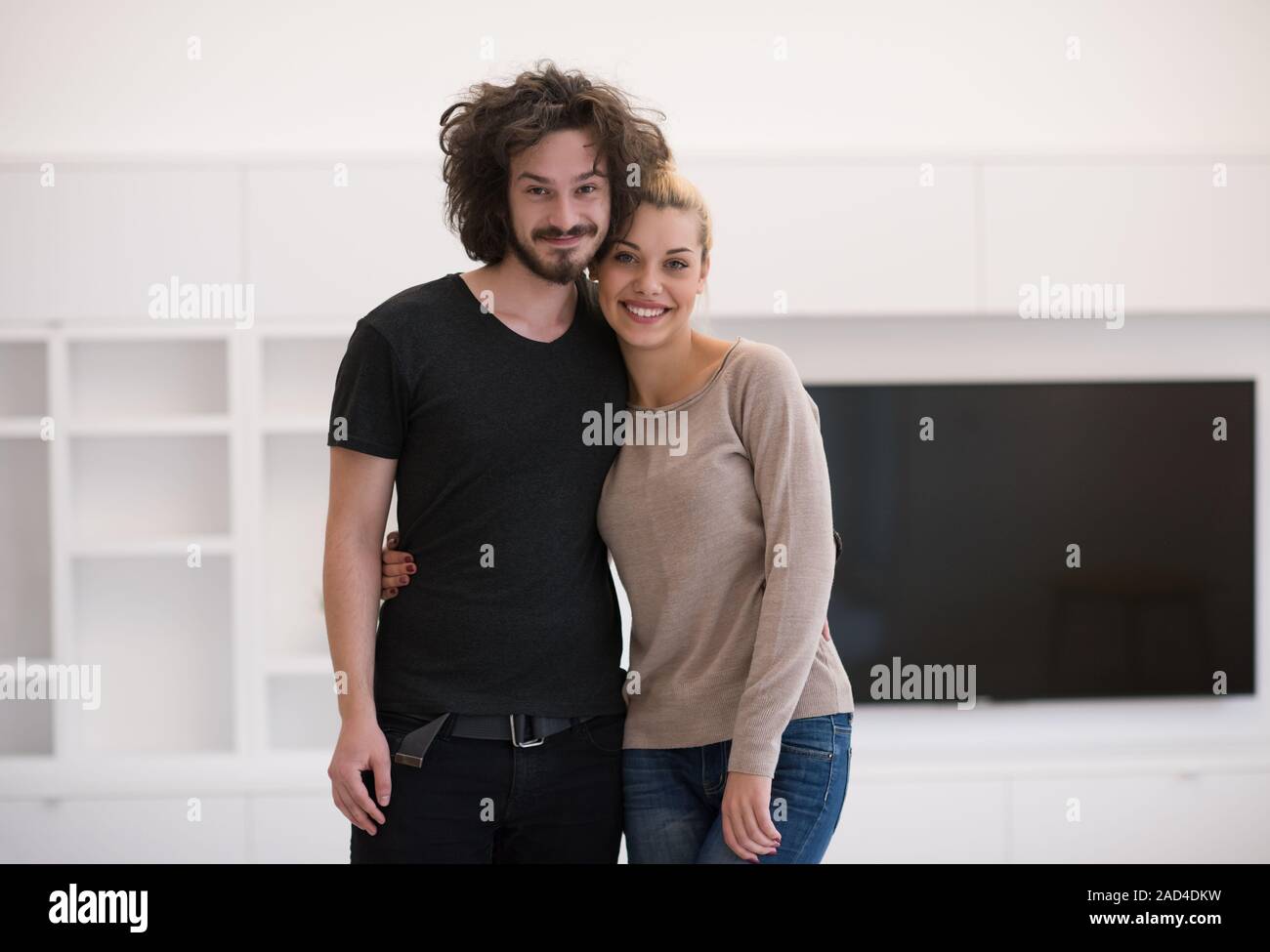 couple hugging in their new home Stock Photo - Alamy