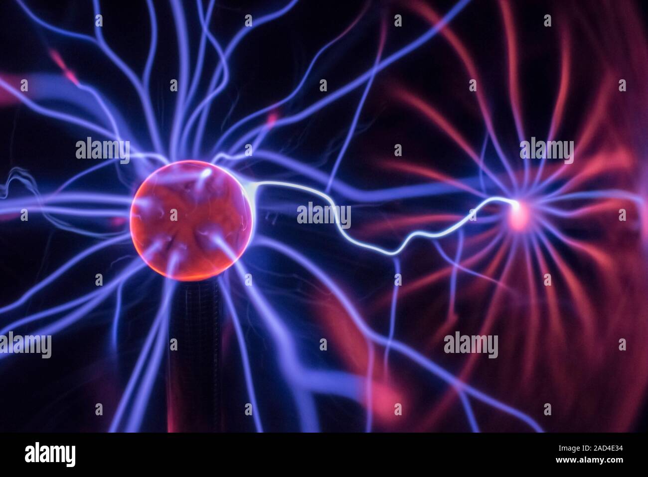 Light streamers inside a plasma globe. A plasma globe is a glass sphere ...