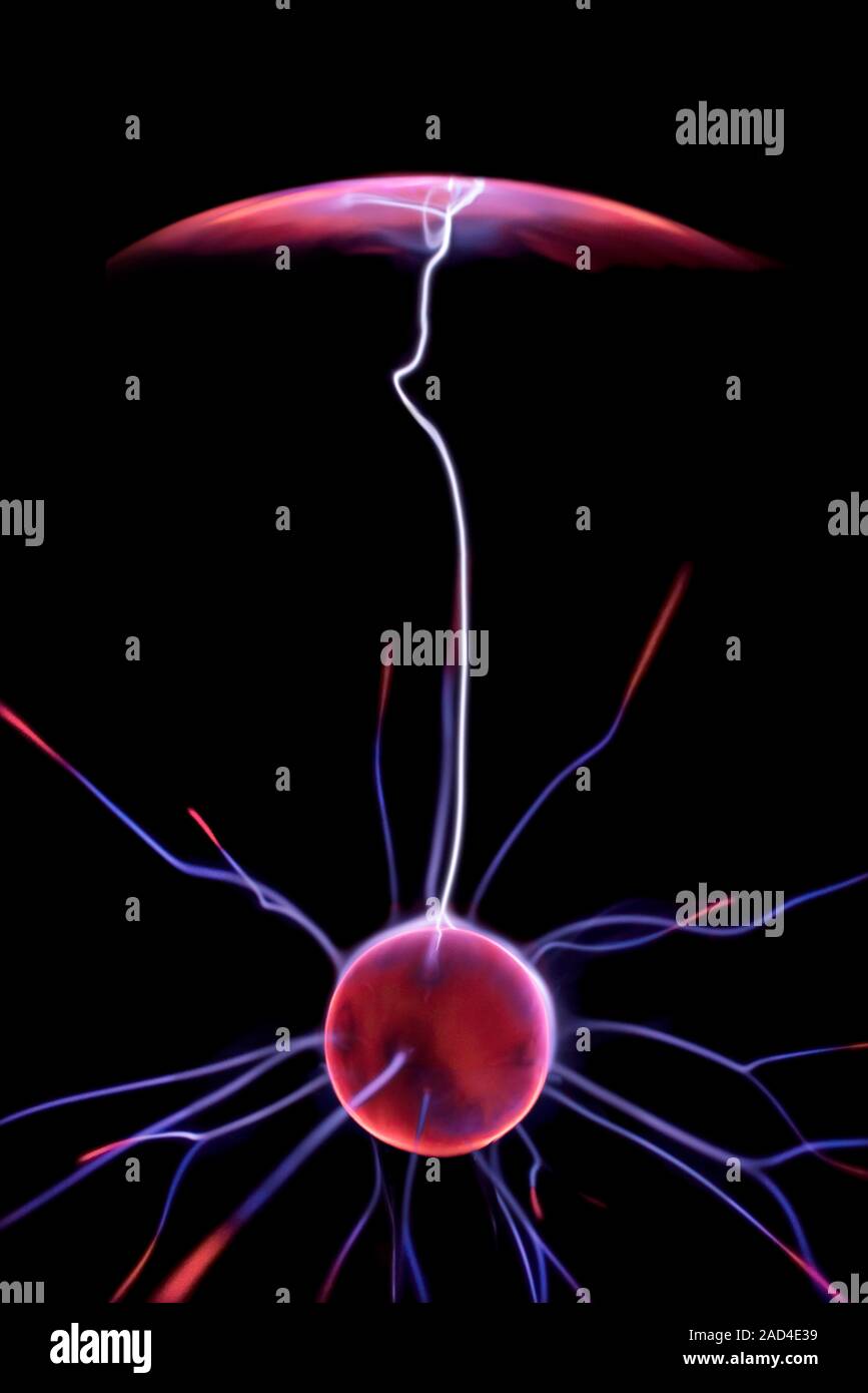 Light streamers inside a plasma globe. A plasma globe is a glass sphere ...