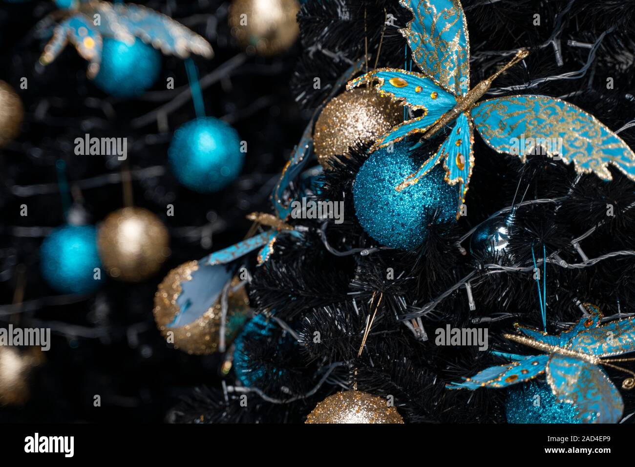 Decorated Christmas tree with a blue and gold toys and beautiful blue ...