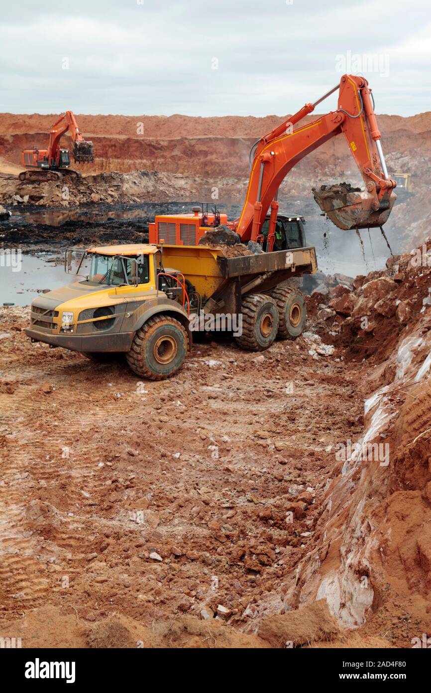 Open-cast coal mine. Diggers at an open-cast coal mine near Witbank ...