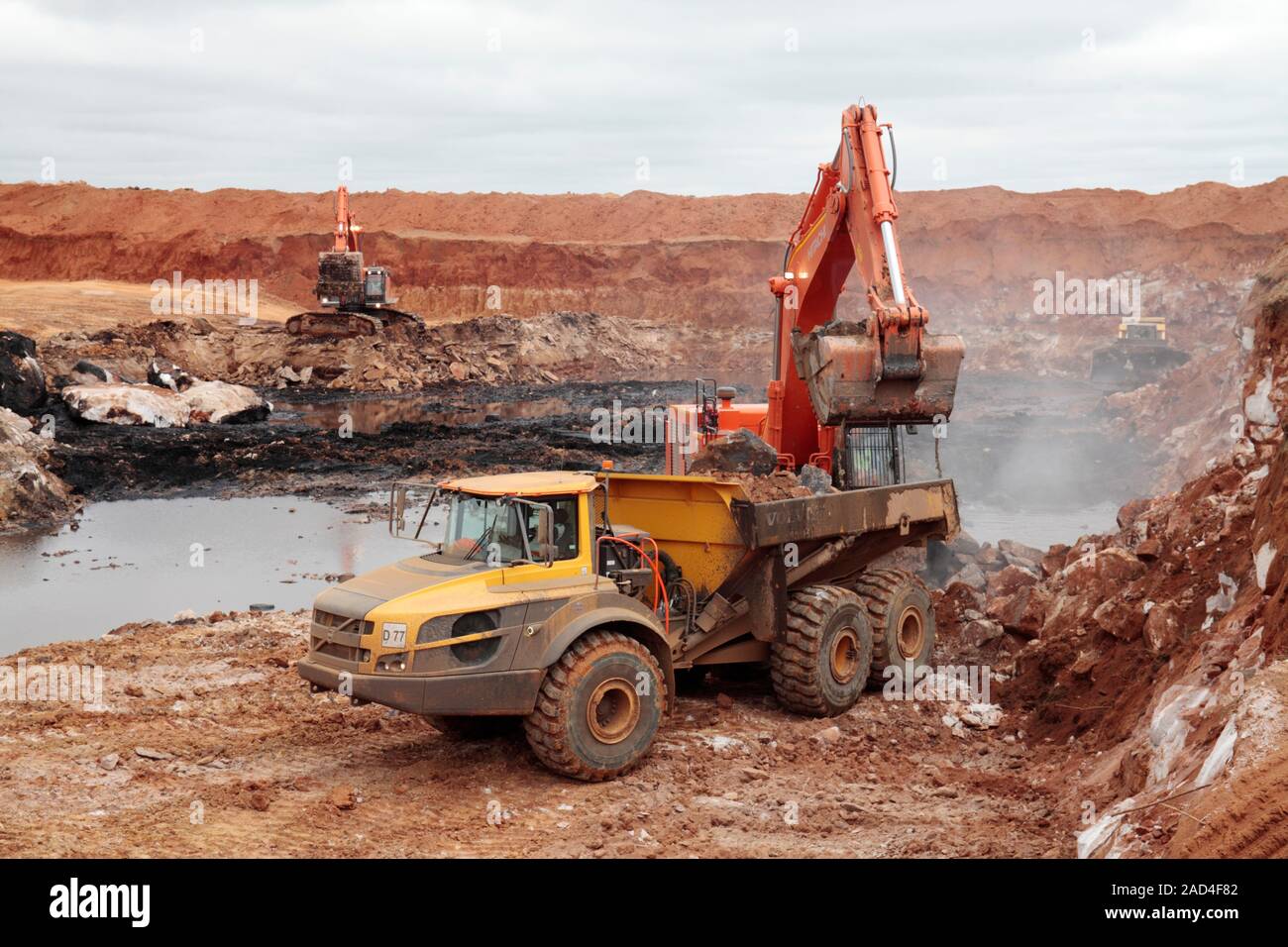 Open-cast coal mine. Diggers at an open-cast coal mine near Witbank ...