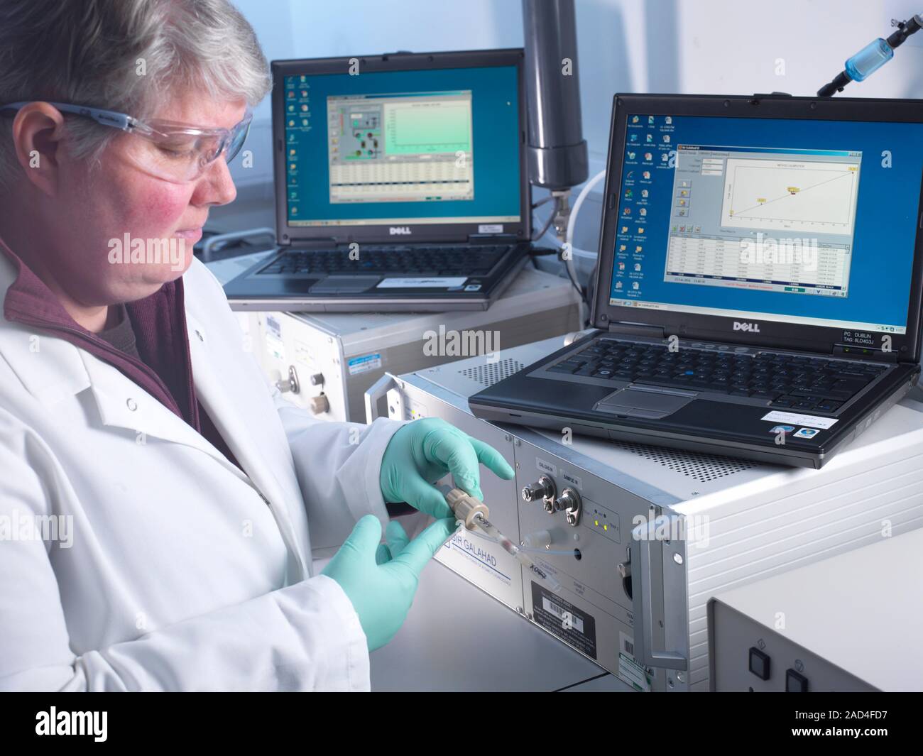 Atomic fluorescence spectroscopy. Researcher using two atomic ...
