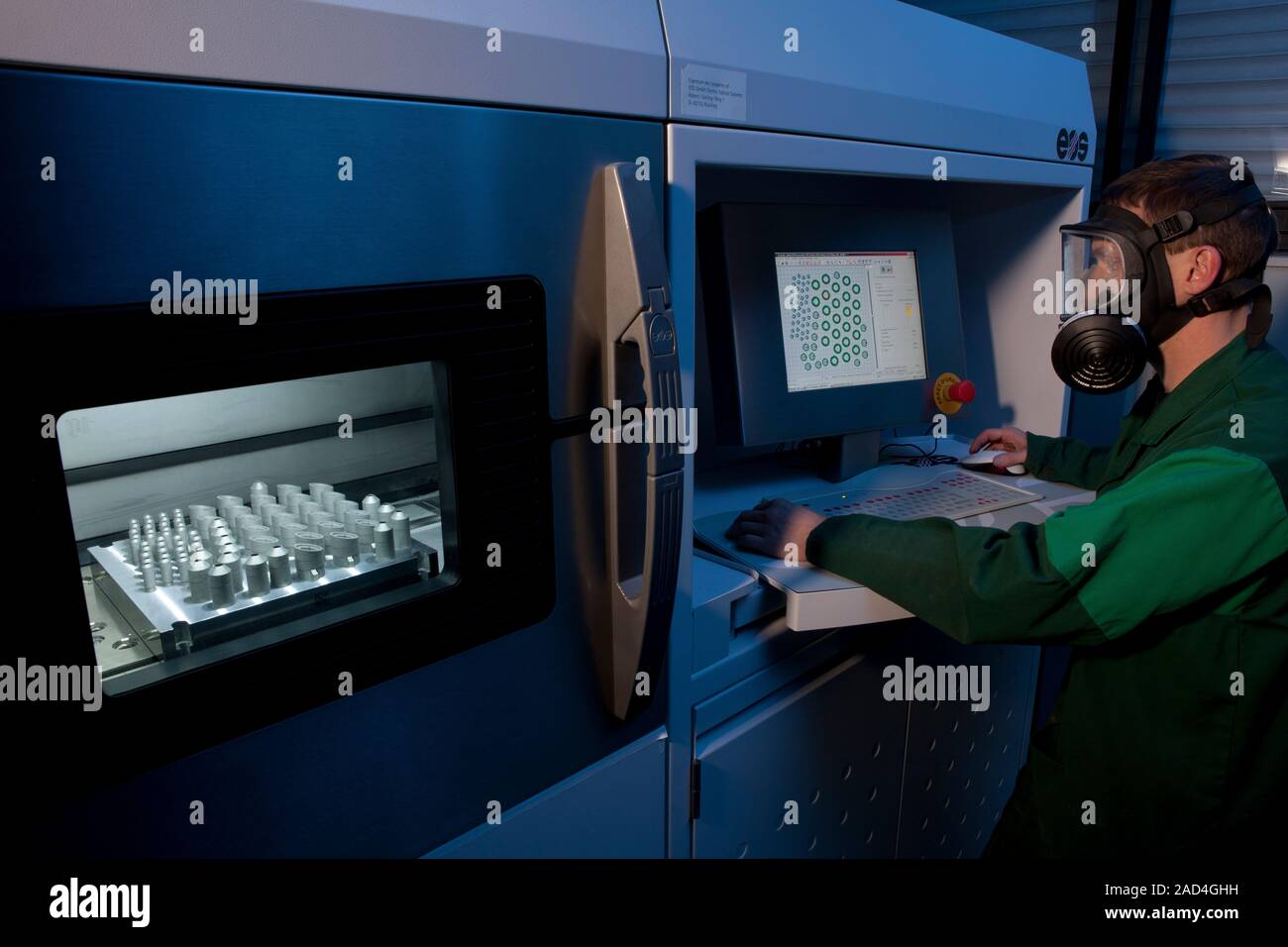 Laser sintering manufacturing. Laser being used to produce metal ...