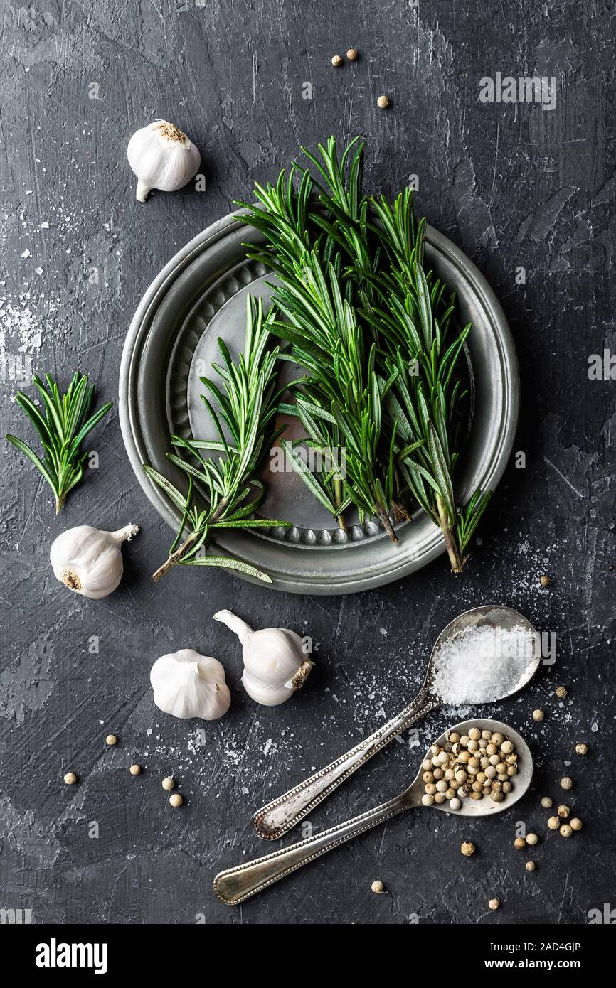 Rosemary, garlic, salt and white pepper, culinary background with ...