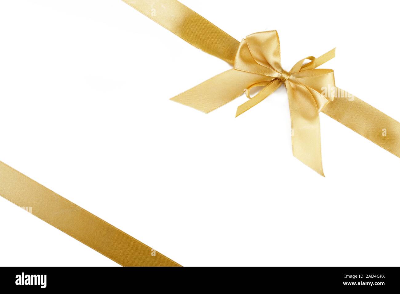 Beautiful gold gift bow isolated on white background Stock Photo - Alamy