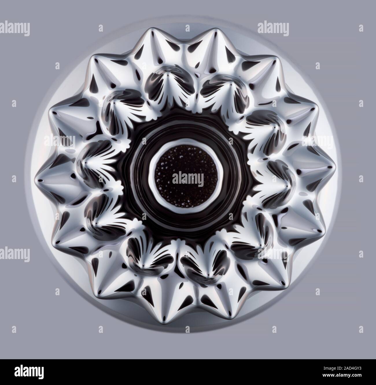 Ferrofluid in the magnetic field produced by a magnet. The peaks formed ...