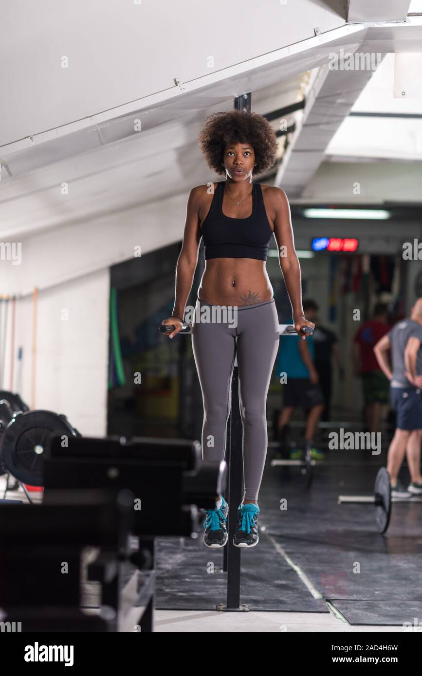 black woman doing parallel bars Exercise Stock Photo - Alamy