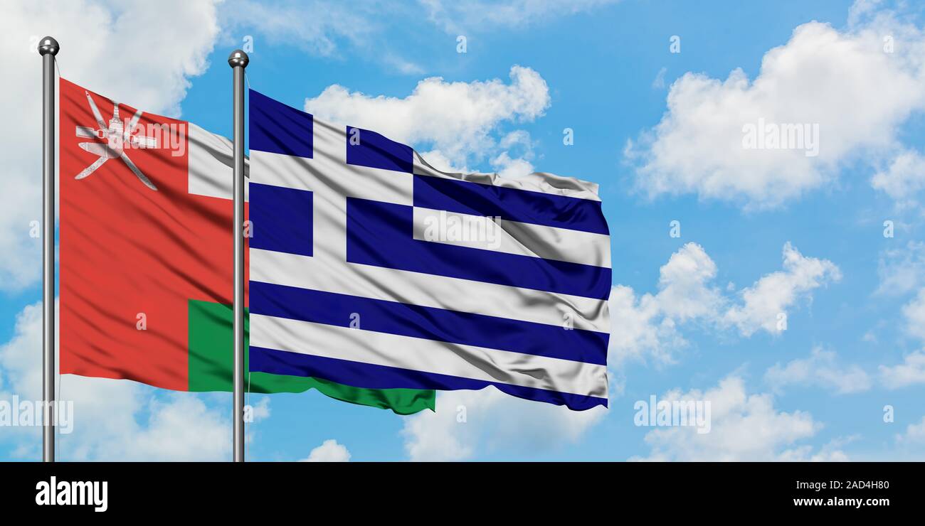 Oman and Greece flag waving in the wind against white cloudy blue sky ...