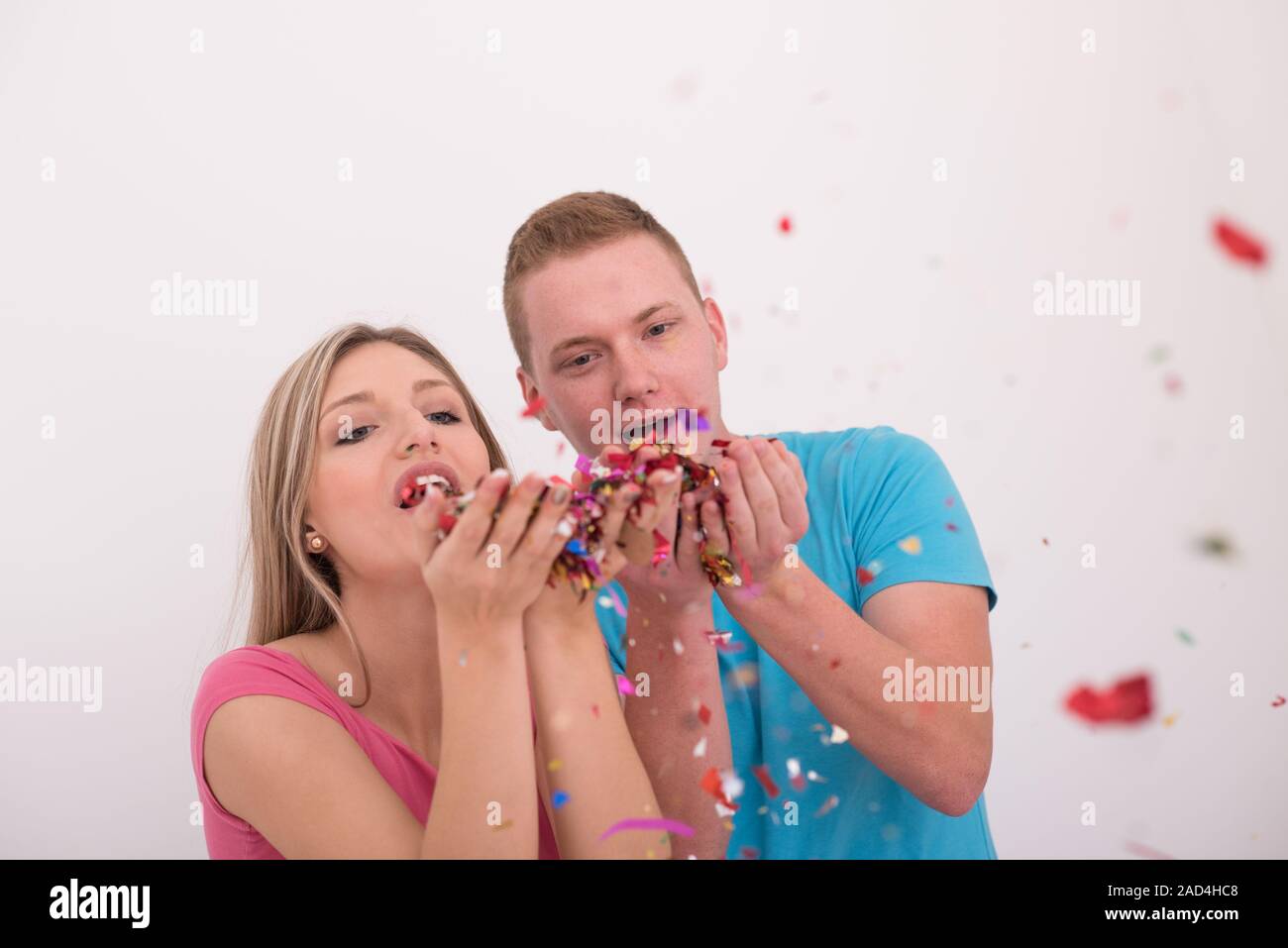 romantic young couple celebrating party with confetti Stock Photo - Alamy