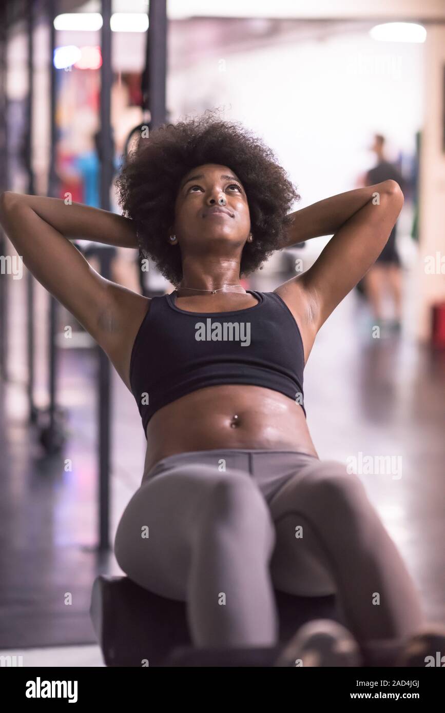 African american woman doing sit ups hi-res stock photography and ...