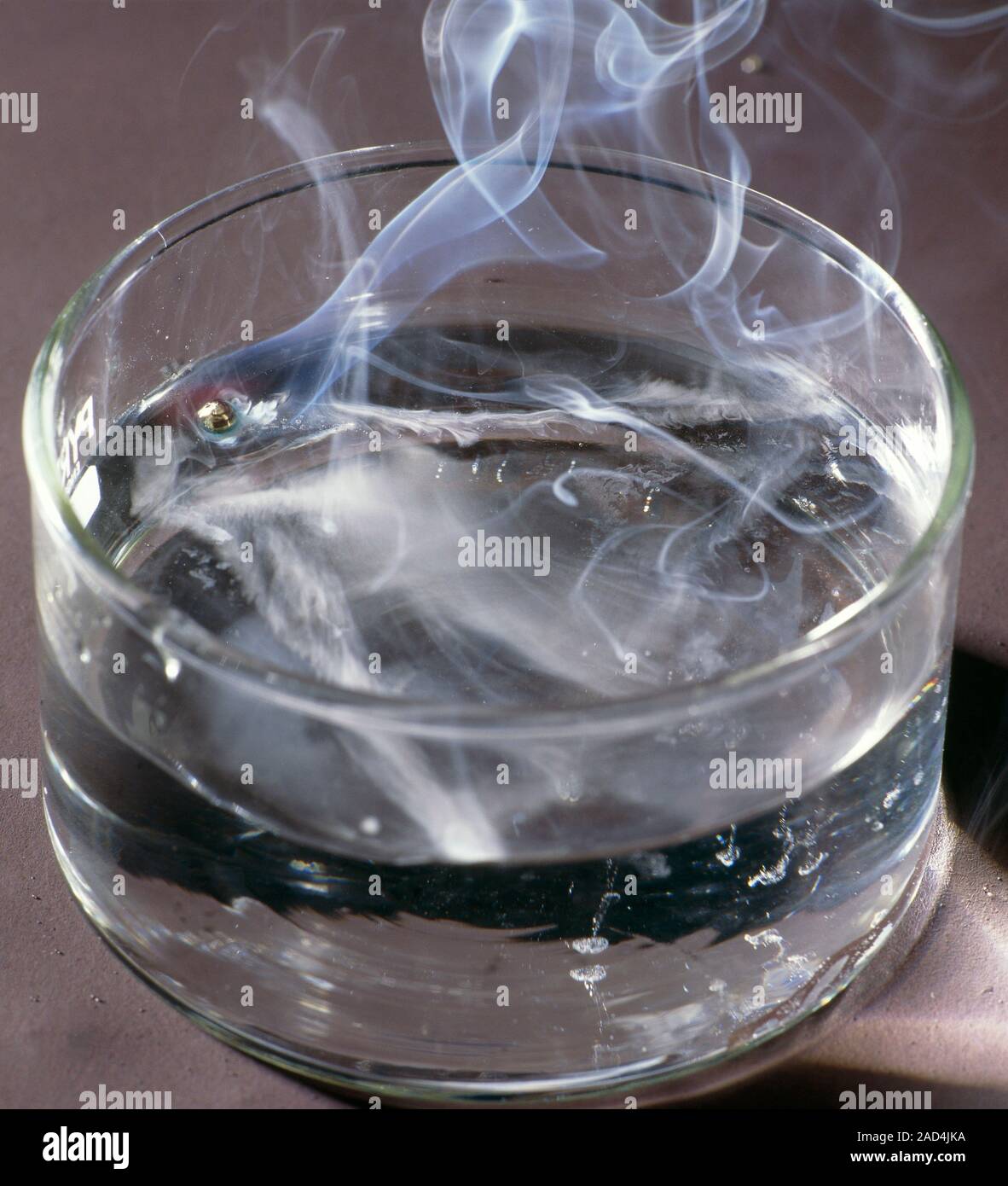 Potassium reacting with water. Potassium (K) is a highly reactive ...