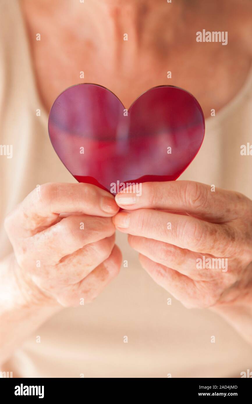 Cardiac health, conceptual image. Close-up of an 81-year-old woman ...
