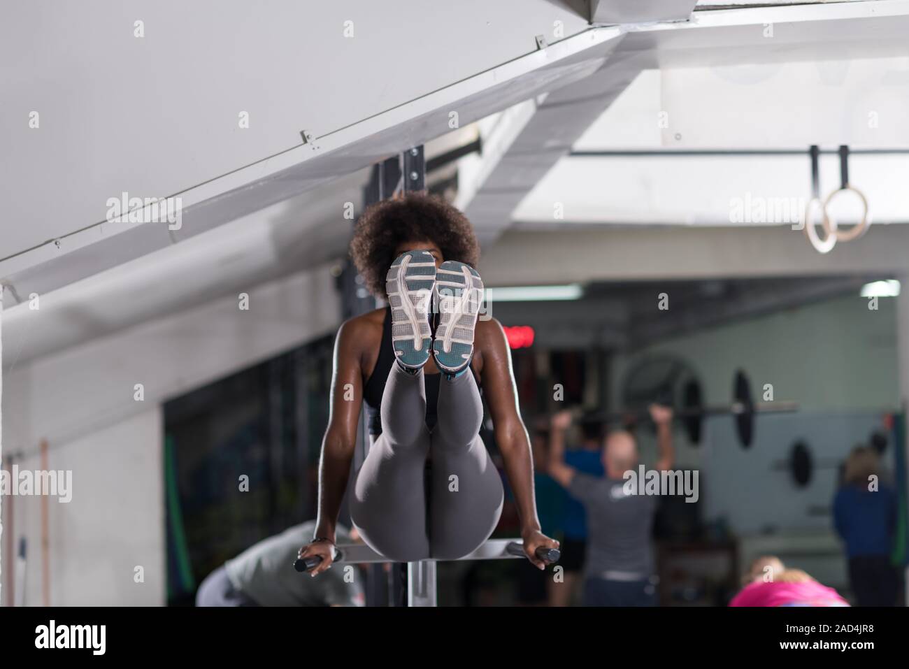 black woman doing parallel bars Exercise Stock Photo - Alamy