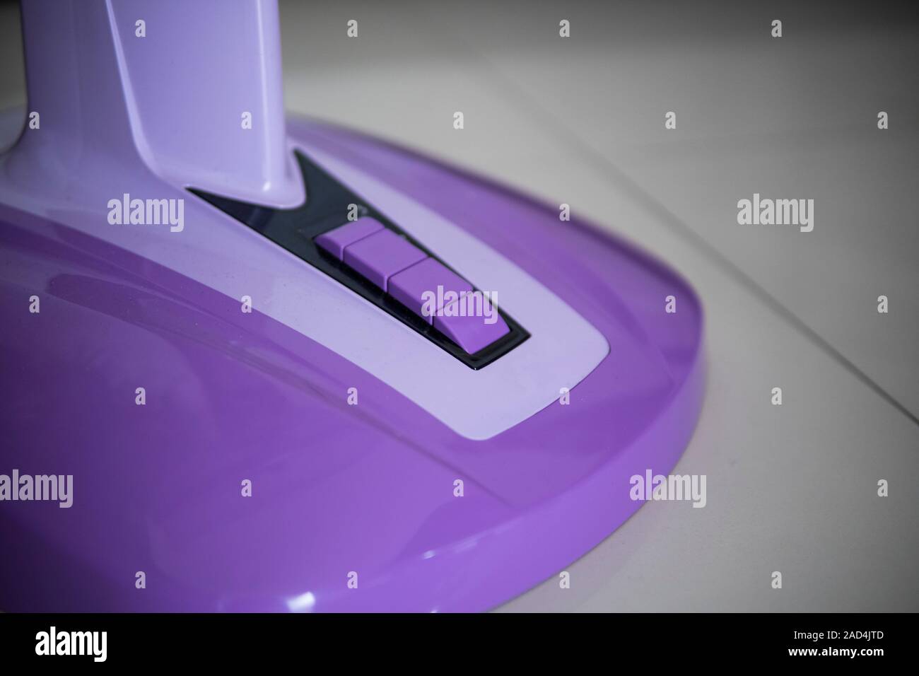 Modern violet electric fan in a living room saving peoples from hot ...