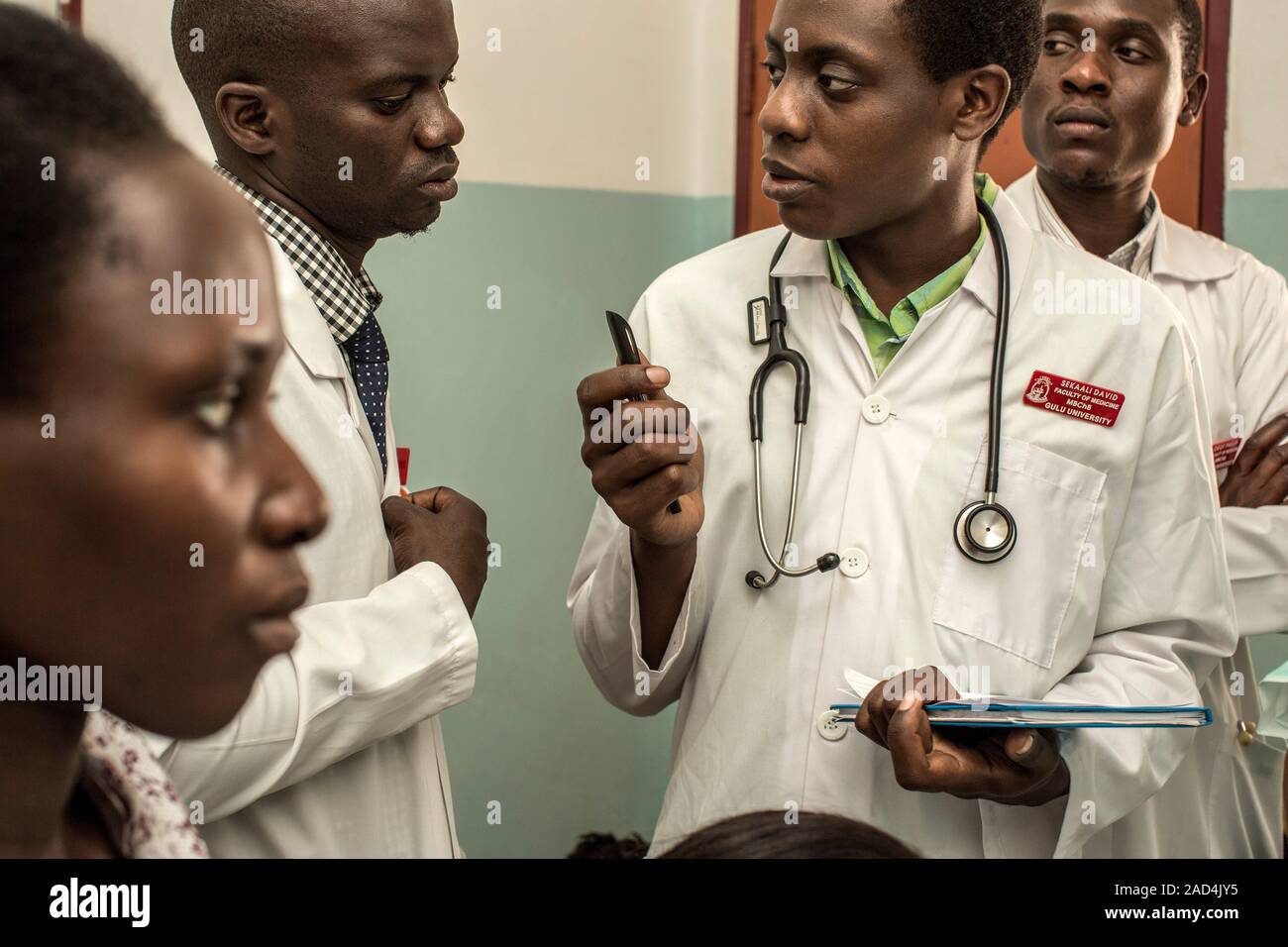 Hospital doctor taking notes. Photographed in St Mary's Hospital, Lacor ...