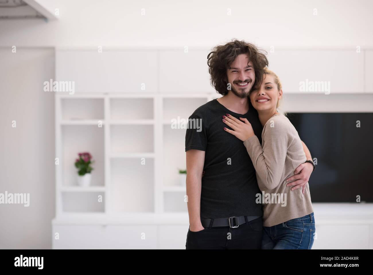 couple hugging in their new home Stock Photo - Alamy