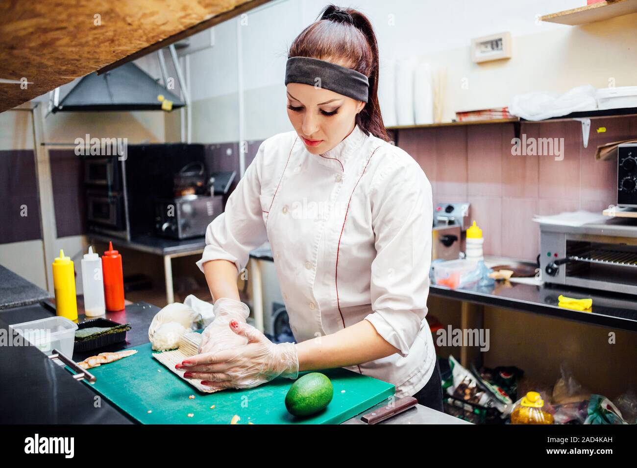 female chef preparing a sushi restaurant in the kitchen Stock Photo - Alamy