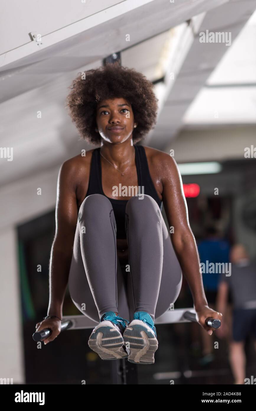 black woman doing parallel bars Exercise Stock Photo - Alamy
