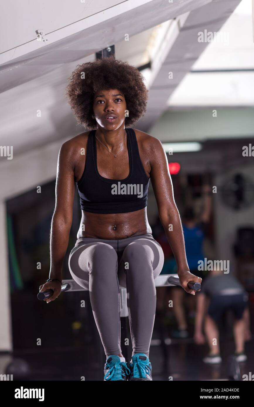 black woman doing parallel bars Exercise Stock Photo - Alamy