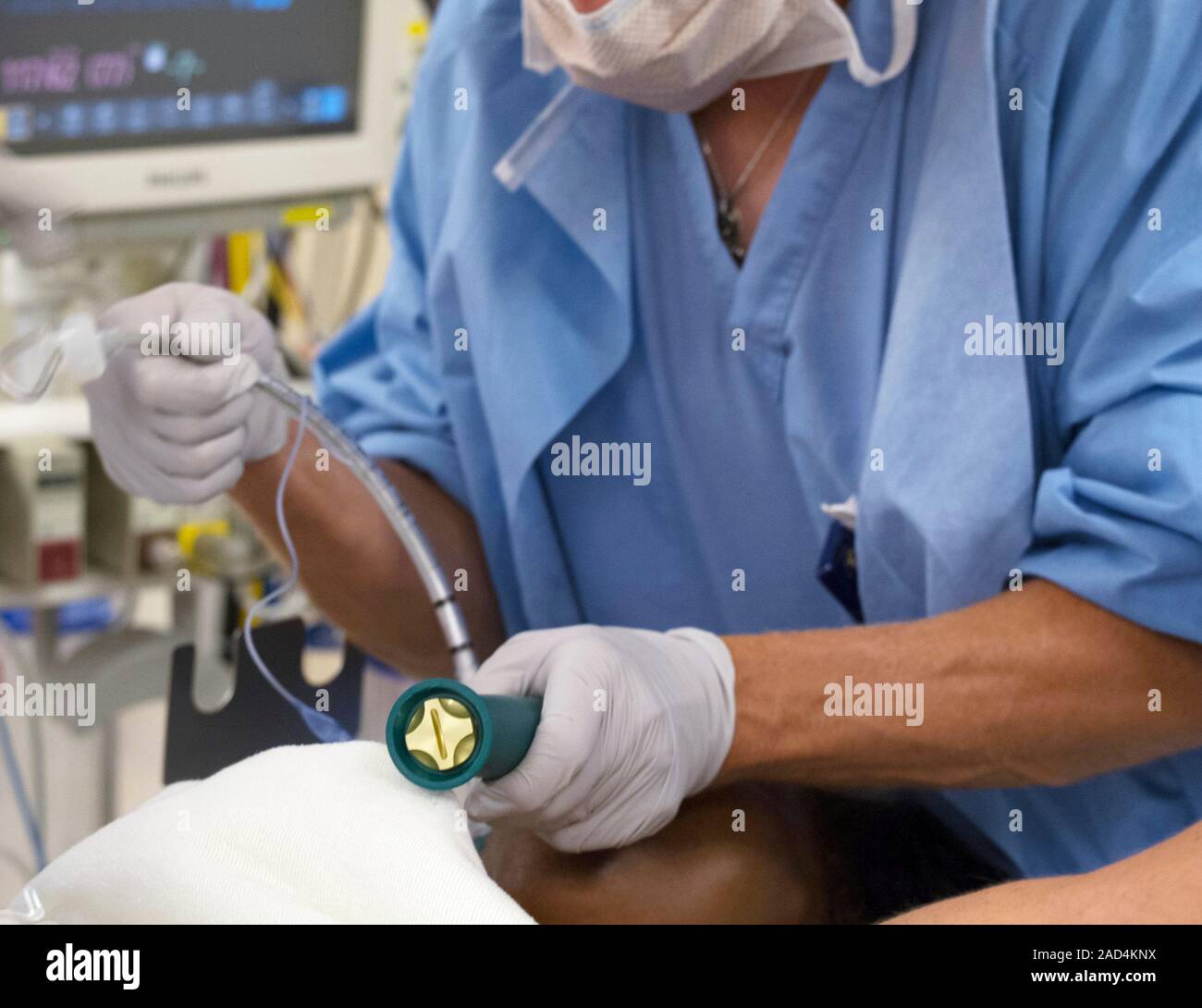 General anaesthesia intubation. Nurse anaesthetist (CRNA) using a ...