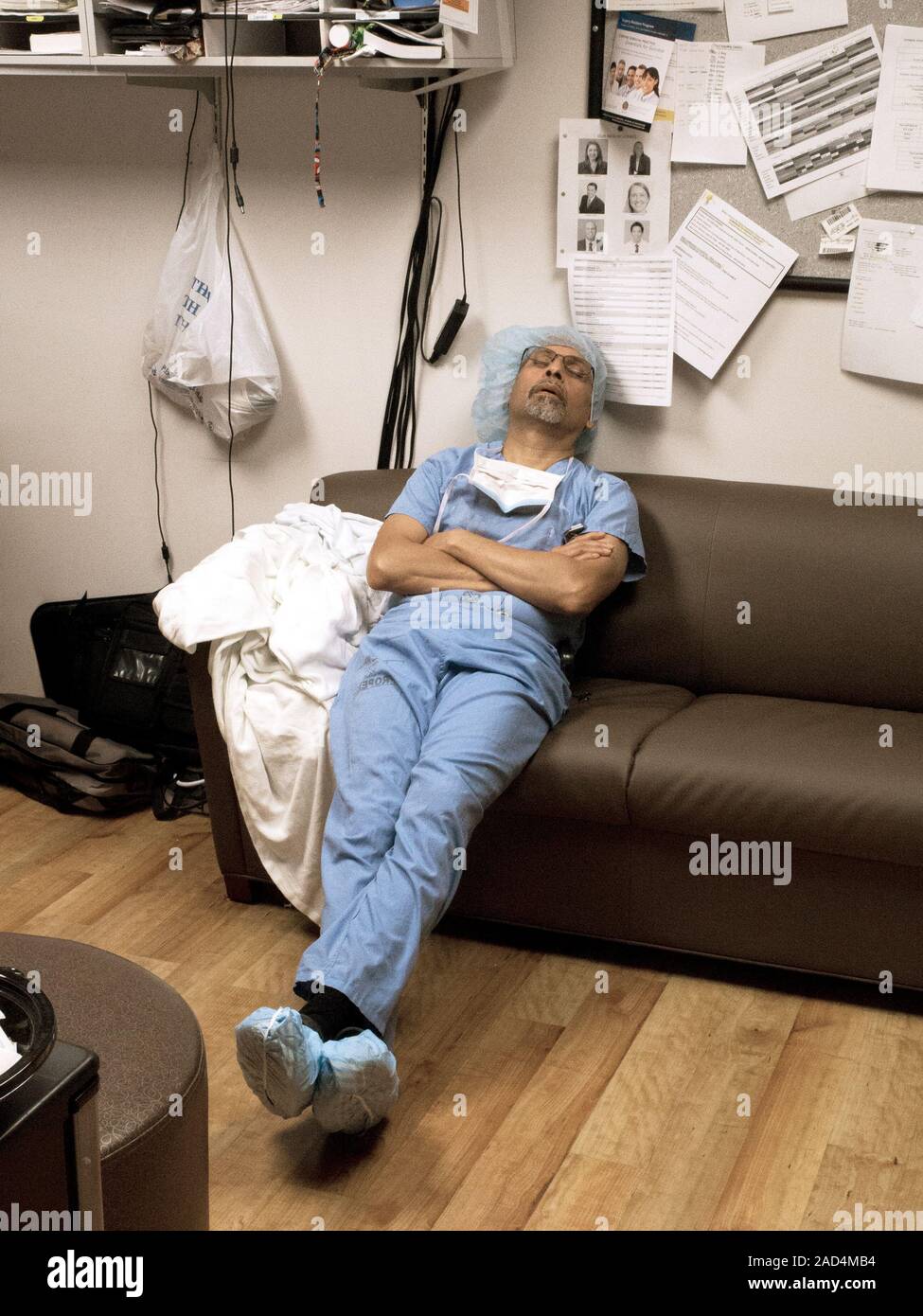 Exhausted surgeon sleeping. Exhausted surgeon sleeping in a surgeons ...