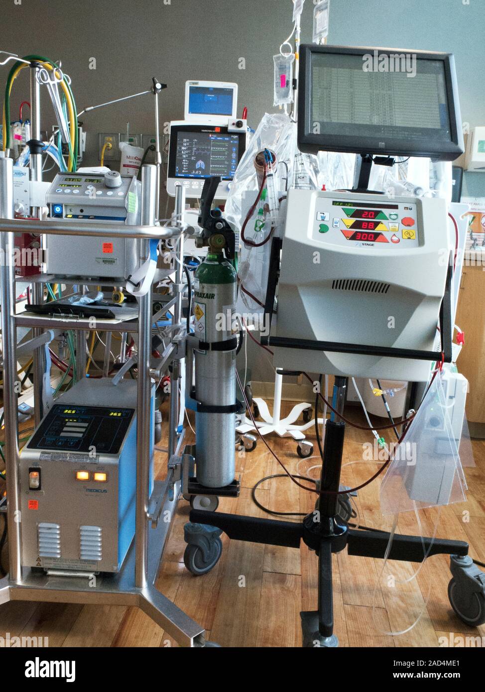 Intensive care unit machines. At left is an extracorporeal membrane ...