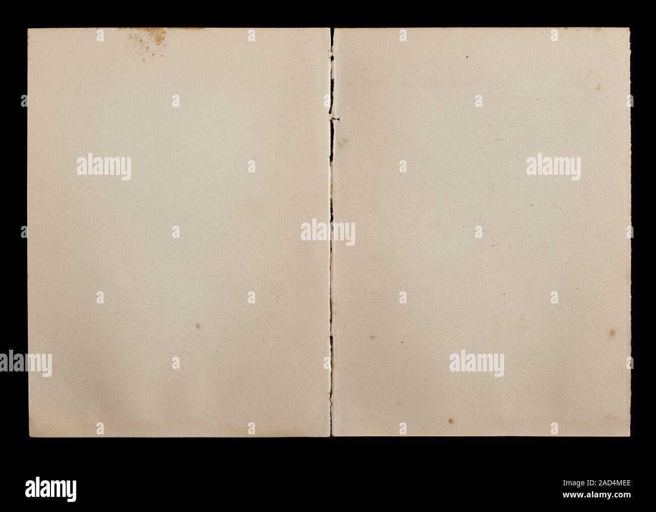 Antique book unfolded showing textured pages isolated on black ...