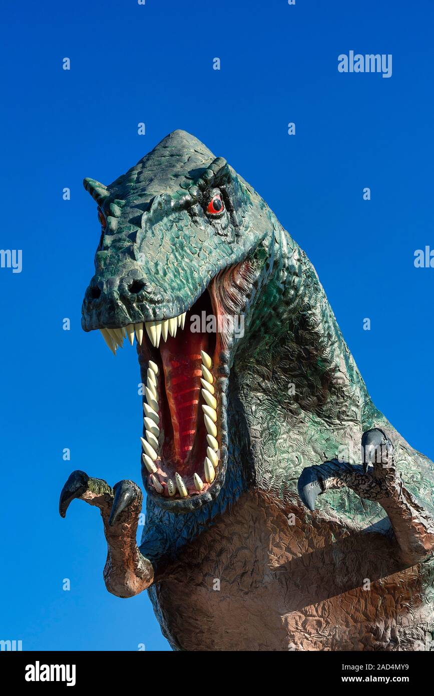 Amusement park dinosaur model. Close-up of a model dinosaur at an ...