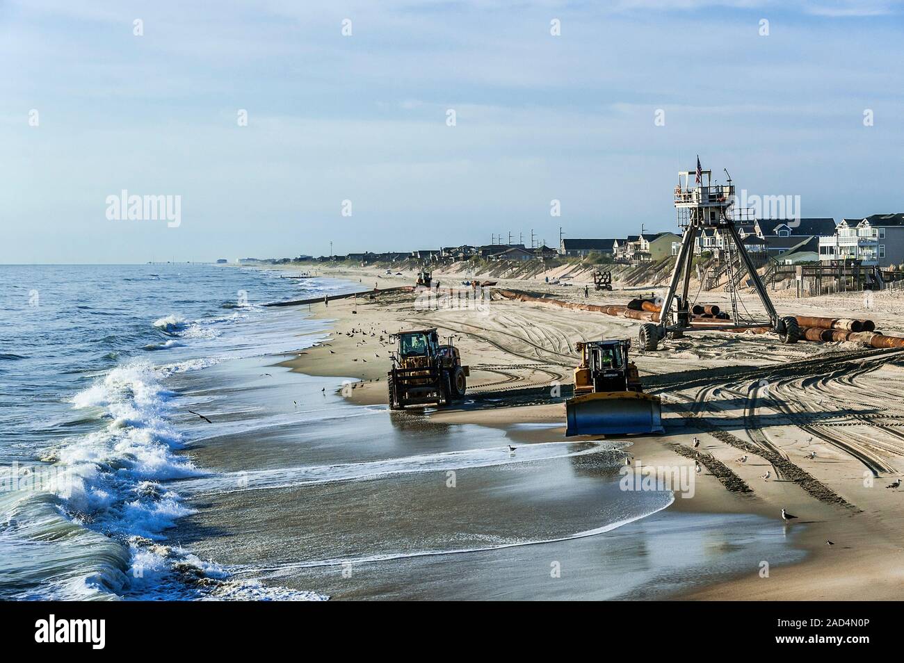 Beach restoration project. Workers rebuilding eroded beaches ...