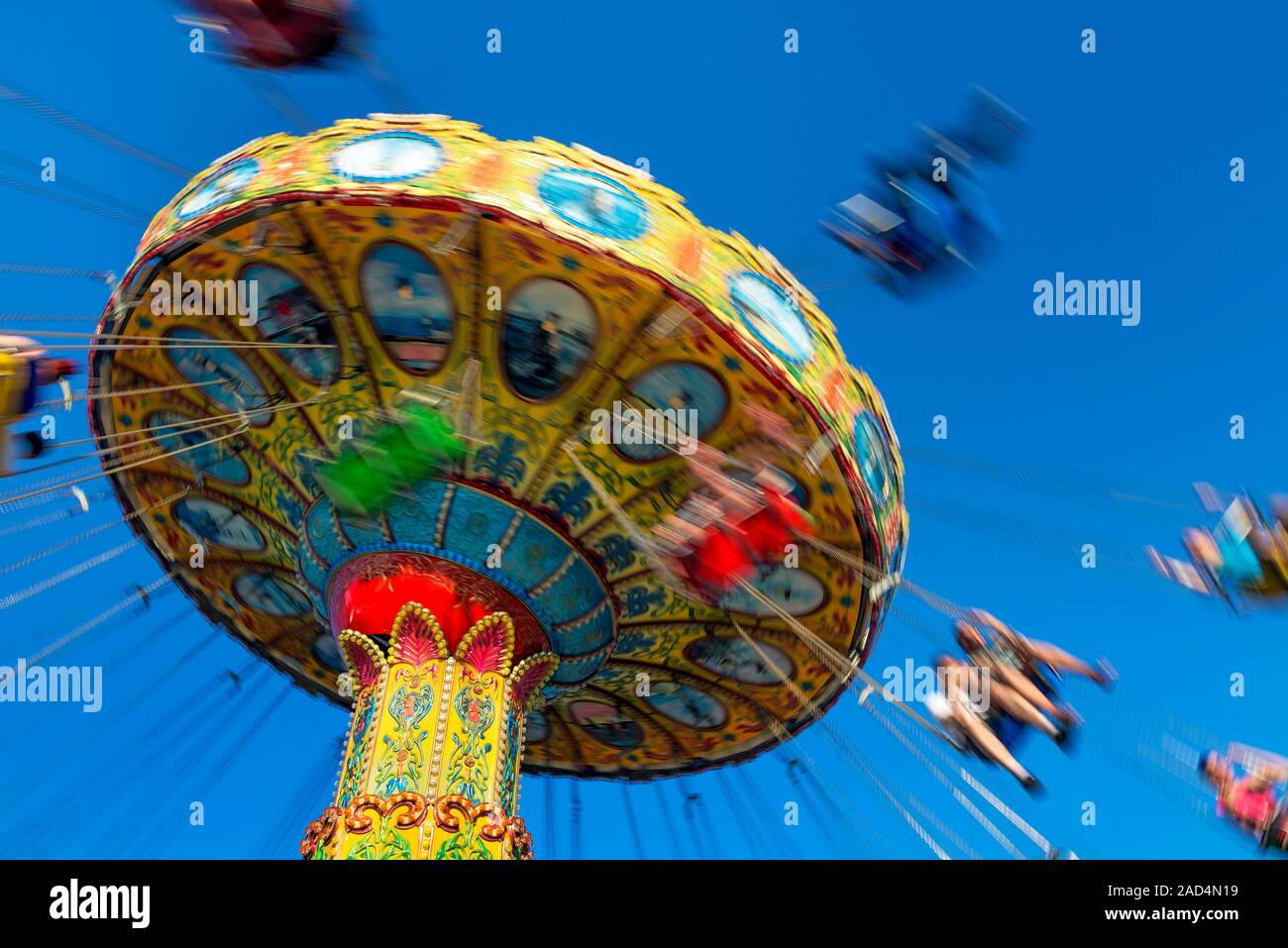 Carousel ride. Time-exposure image of people, on a carousel ride at an ...