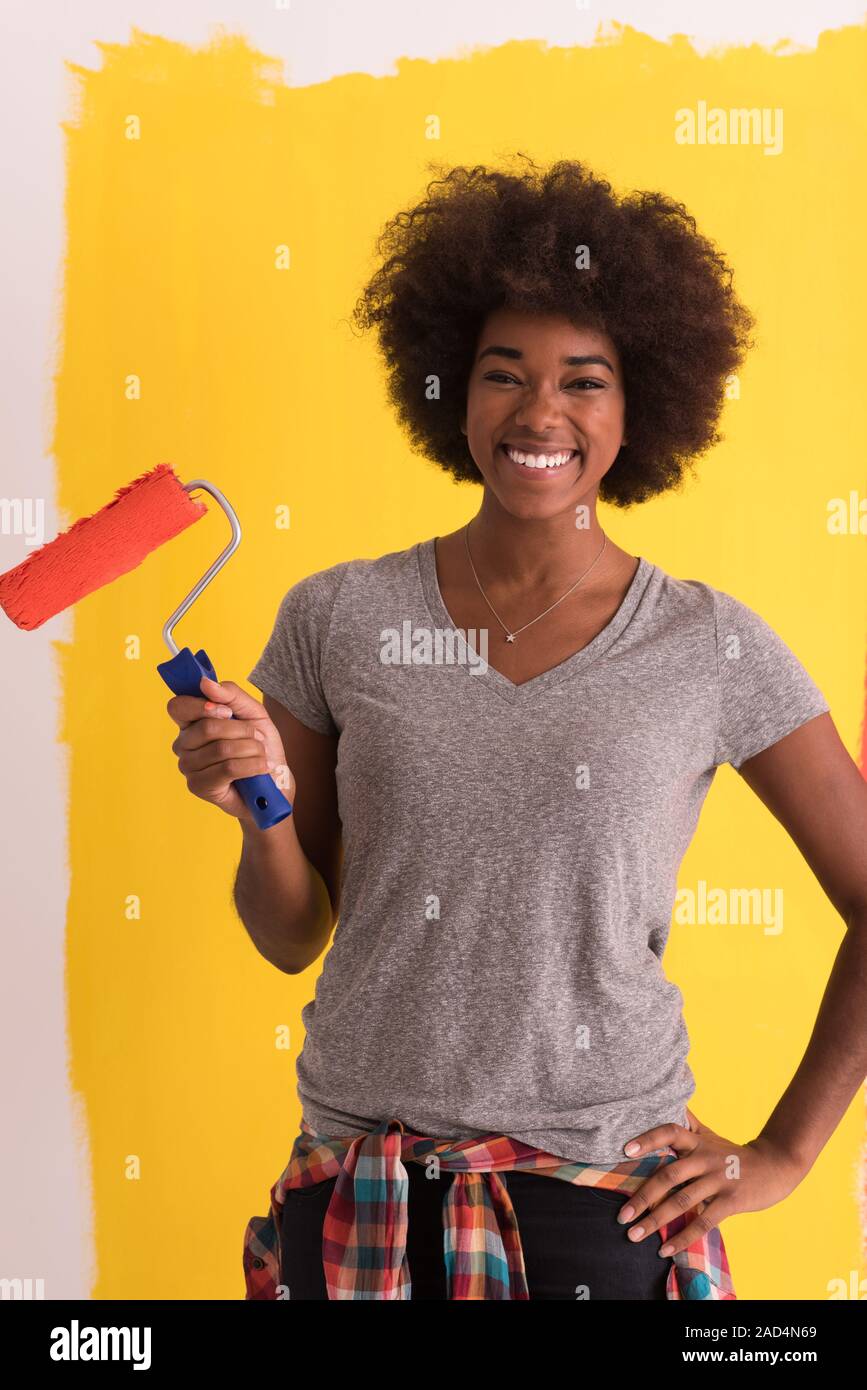 black woman painting wall Stock Photo - Alamy