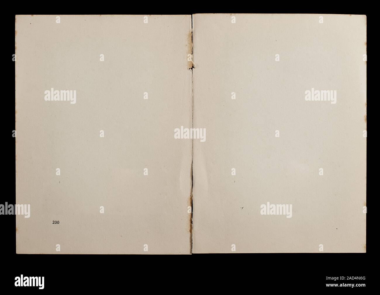 Antique book unfolded showing textured pages isolated on black ...