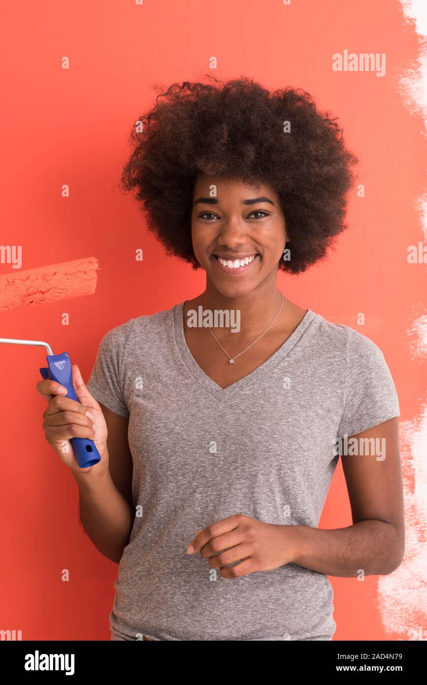 black woman painting wall Stock Photo - Alamy